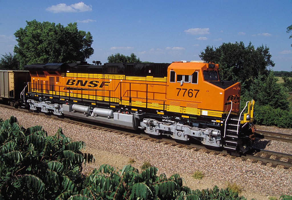 BNSF 7767, GE ES44DC (GEVO), Brand New DPU unit on the rear of a westbound hopper train
